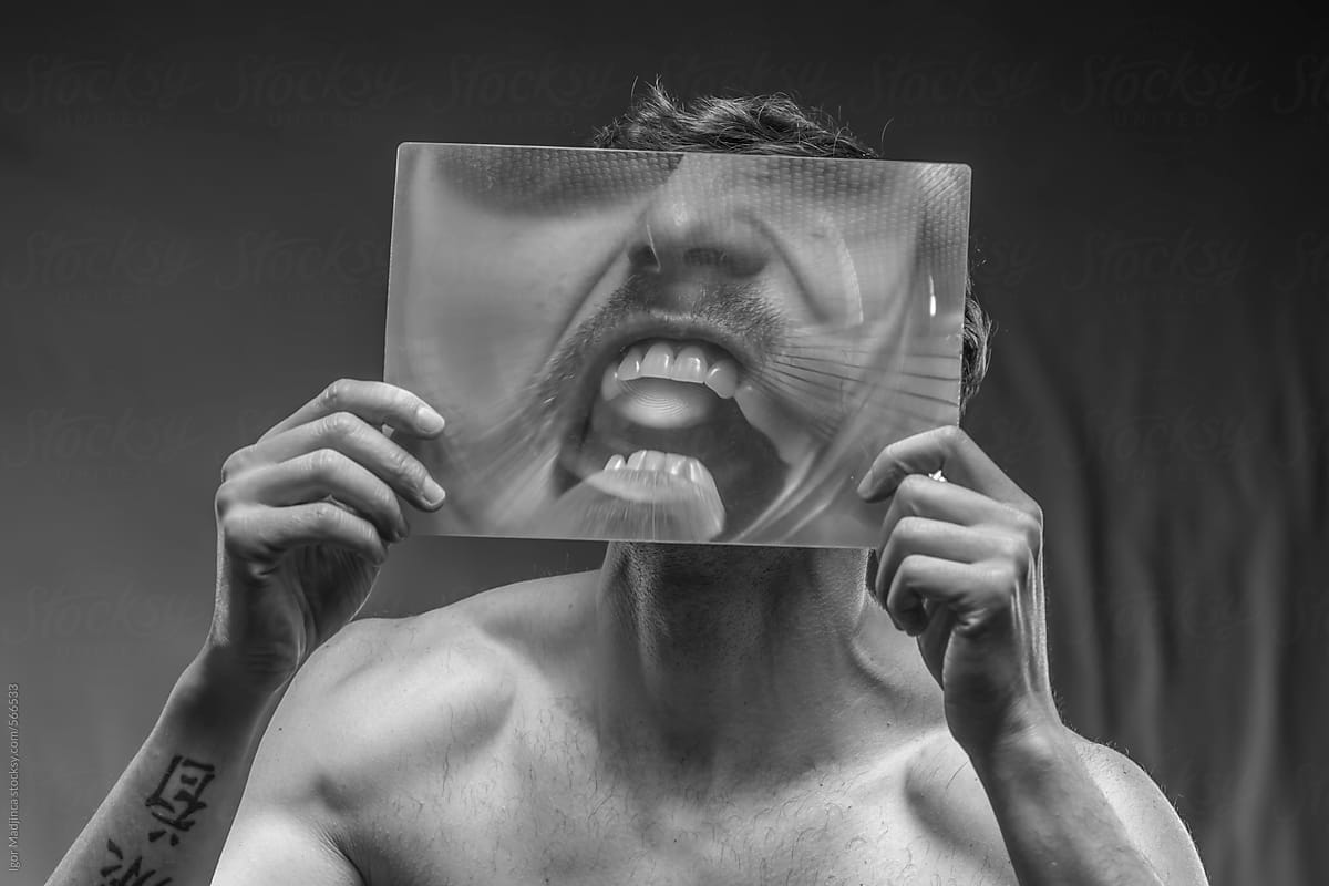 "Scream, Guy With Tattoos And A Magnifying Glass Screaming" by Stocksy ...