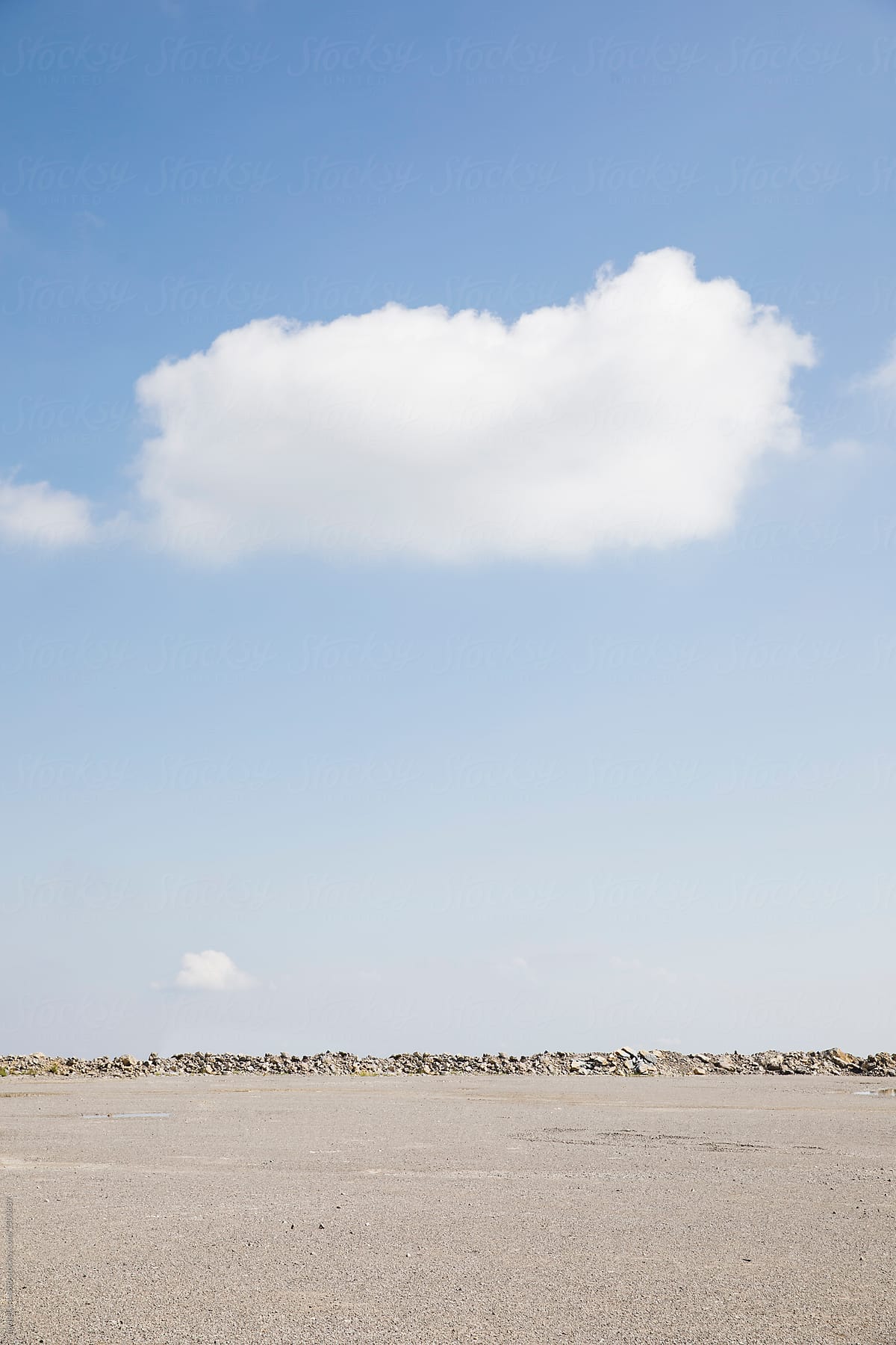 "Isolated Cloud On A Ground" by Stocksy Contributor "Michela Ravasio ...