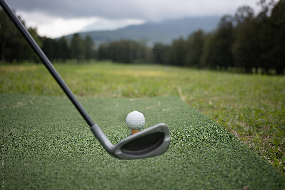 "Golf Ball And Club On Grass" by Stocksy Contributor "Artem Zhushman ...