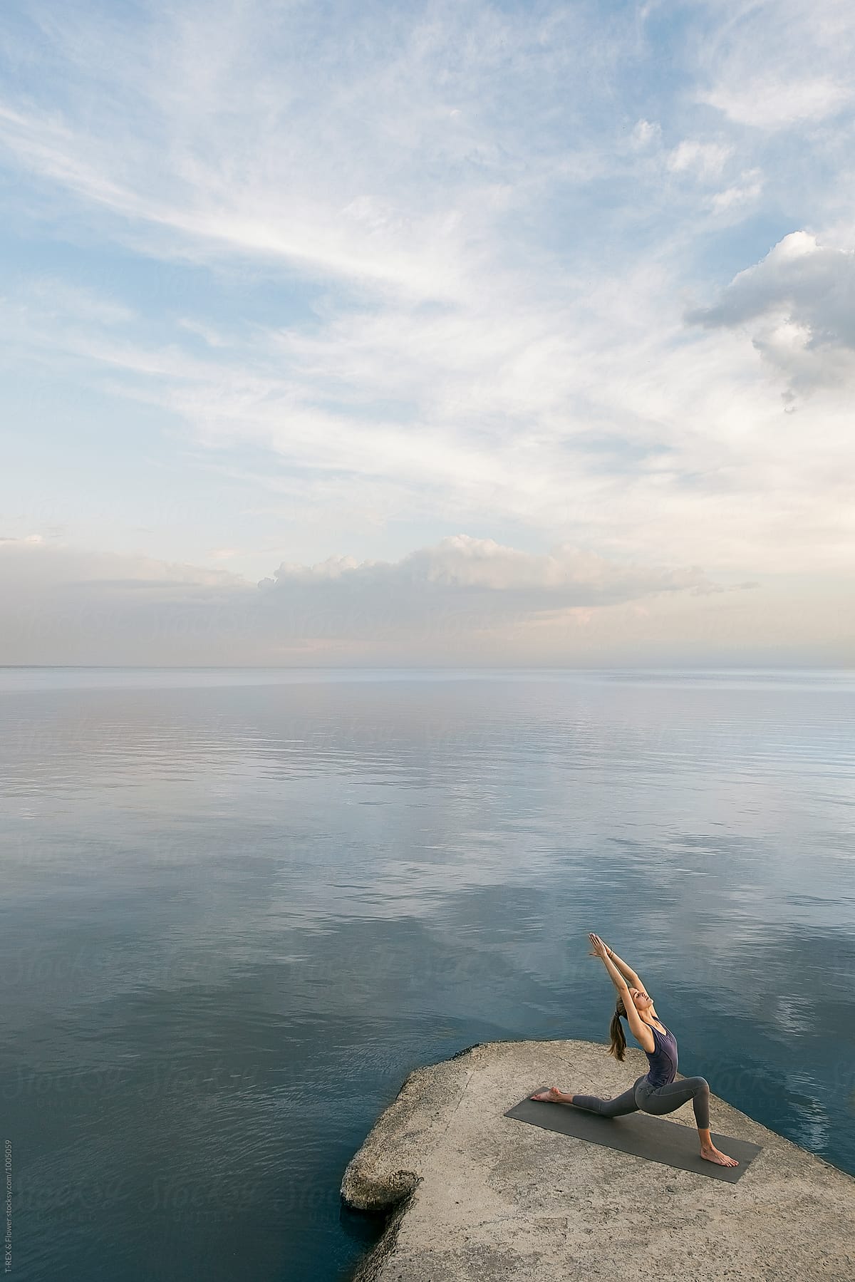 "Woman In Low Lunge At Waterfront" by Stocksy Contributor "Danil Nevsky ...