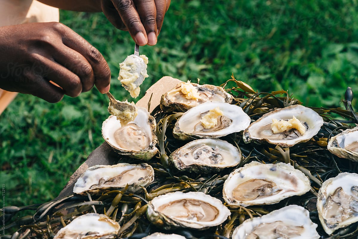 "Preparing Raw Oysters With Miso Butter" by Stocksy Contributor "Jen ...