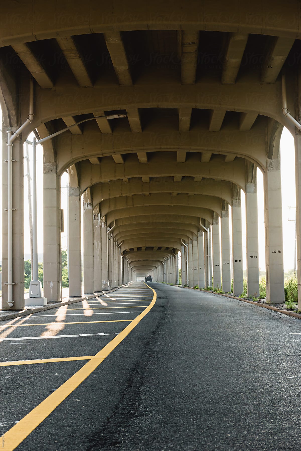 "Road Under Subway Train Track" by Stocksy Contributor "Preappy" - Stocksy