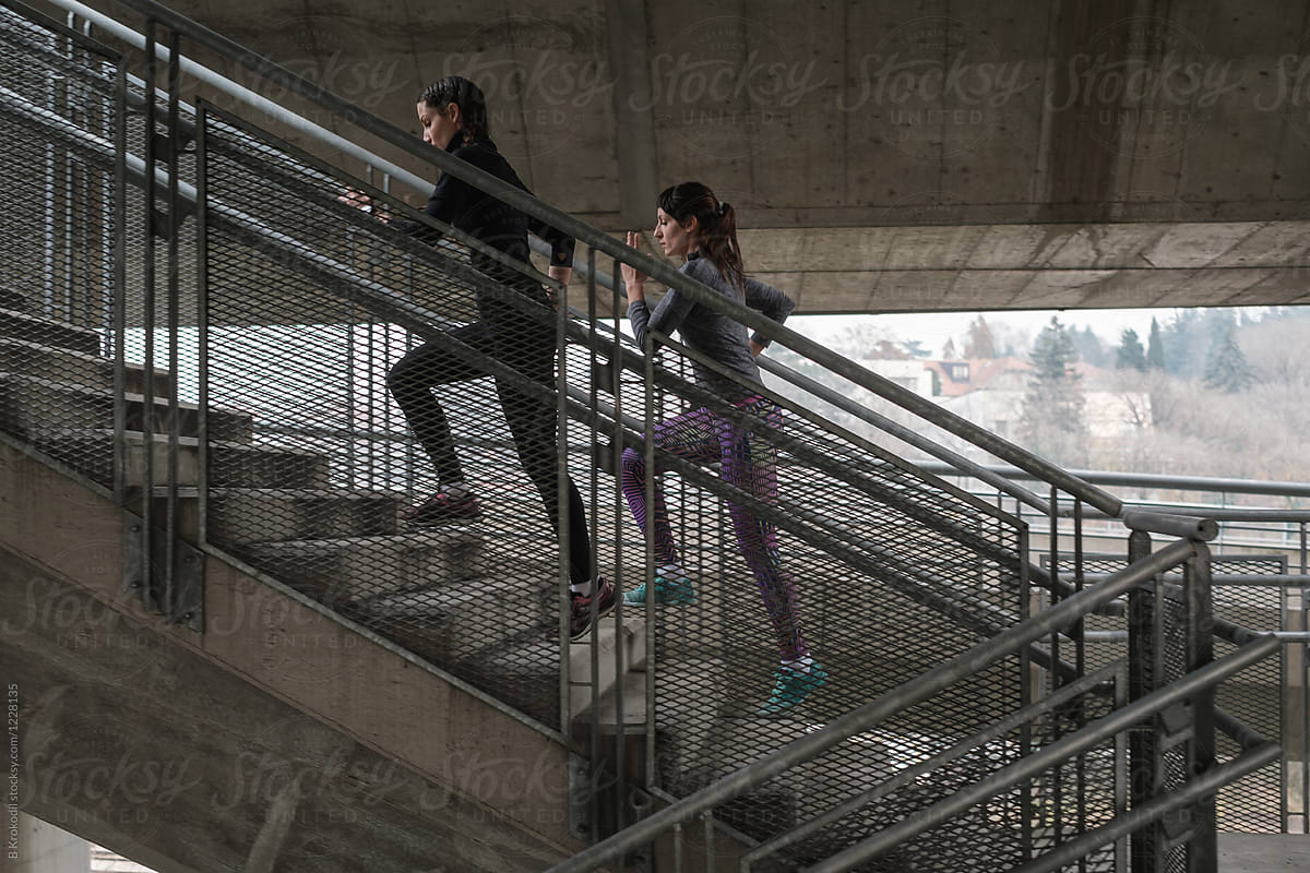 "Two Women Running Up The Stairs Together" by Stocksy Contributor "B ...