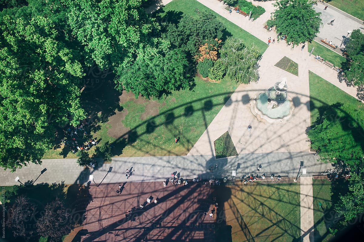 "Shadow Of A Ferris Wheel In A Park" by Stocksy Contributor "Beatrix ...