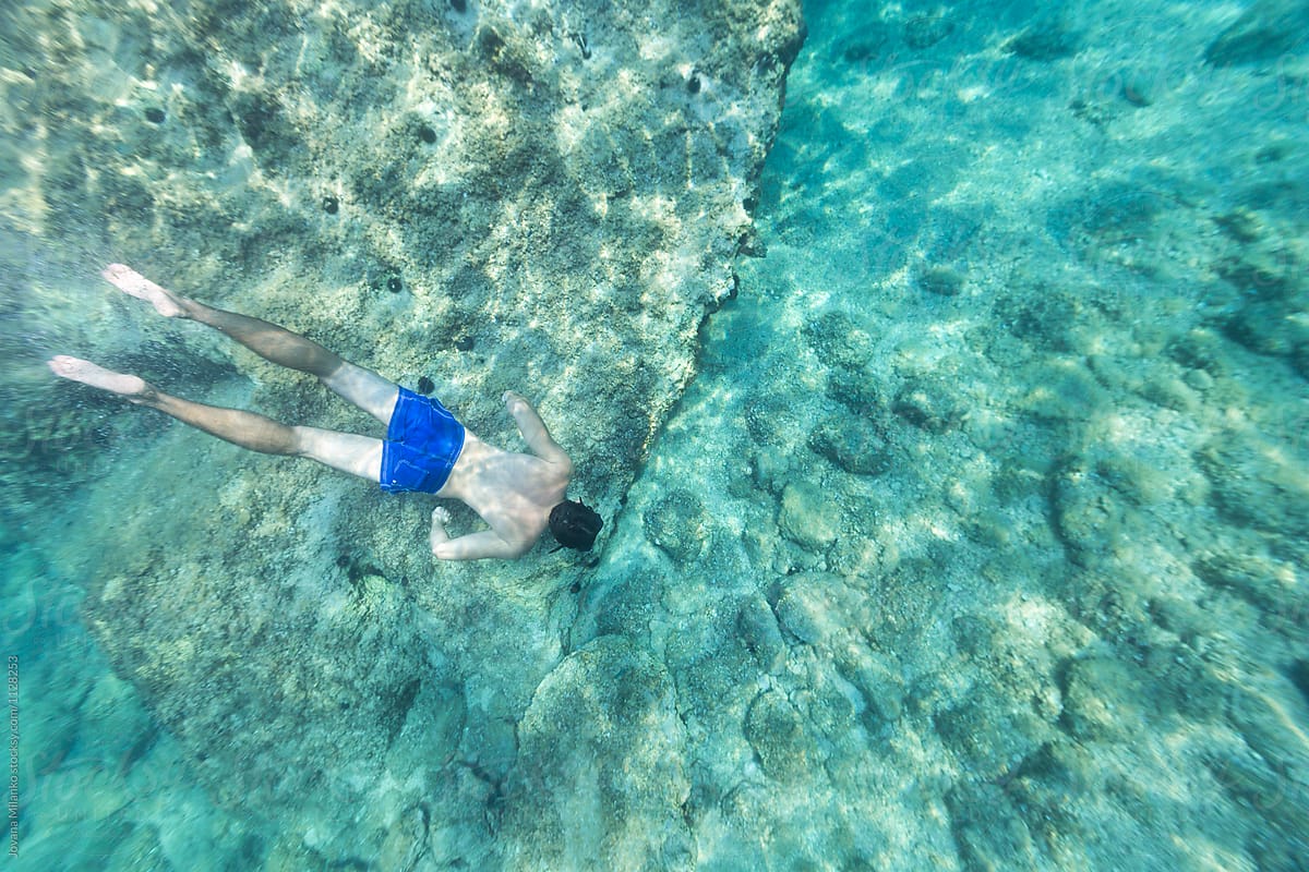 "Young Man Diving In The Sea Underwater" by Stocksy Contributor "Jovana ...