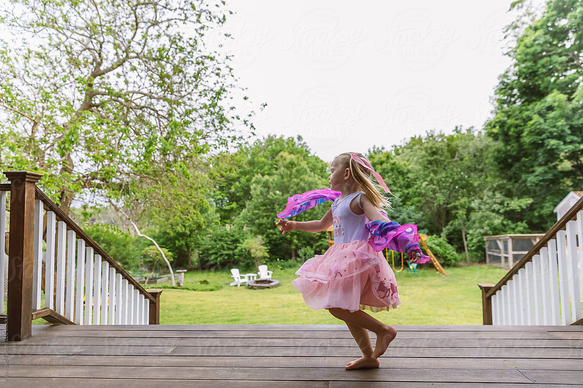 "Pink Fairy Girl Doing Ballet Dance Performance On Porch" by Stocksy ...