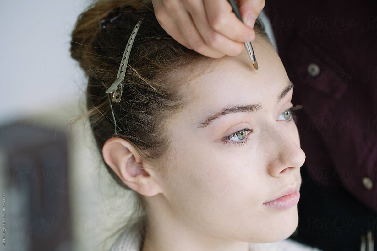 "Makeup Artist Applying Makeup To Model" by Stocksy Contributor "Studio ...