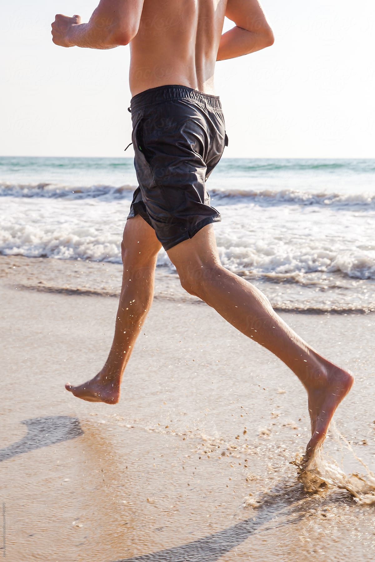 "Man Running On The Beach At Sunset" by Stocksy Contributor "Jovo ...