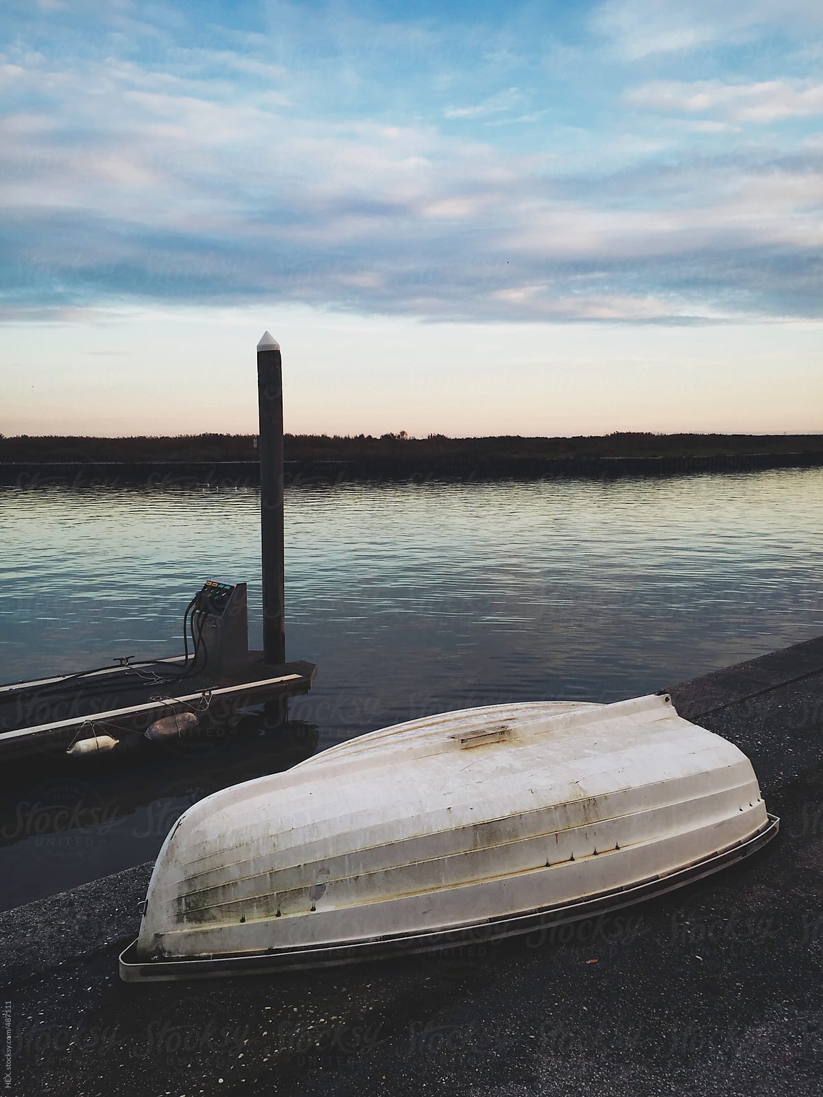 "Disused Boat On A Peer" by Stocksy Contributor "Mattia" - Stocksy