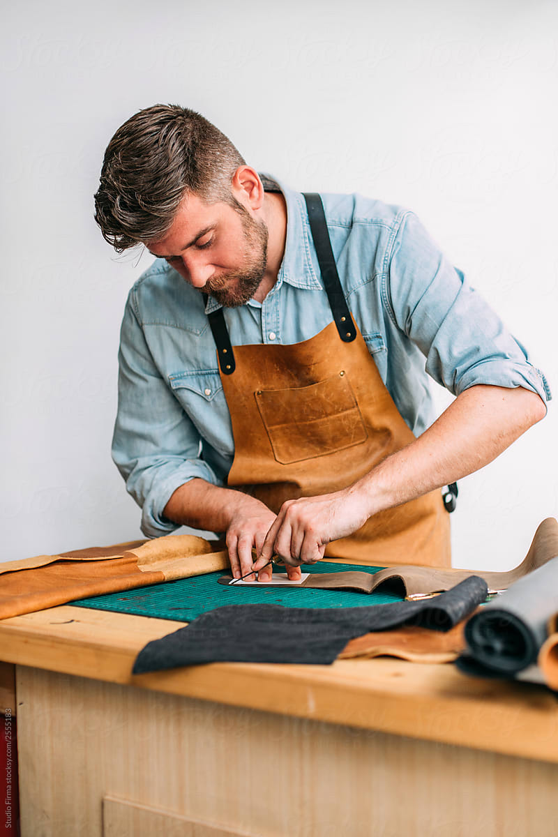 "A Man Who Makes Bags" by Stocksy Contributor "Studio Firma" - Stocksy