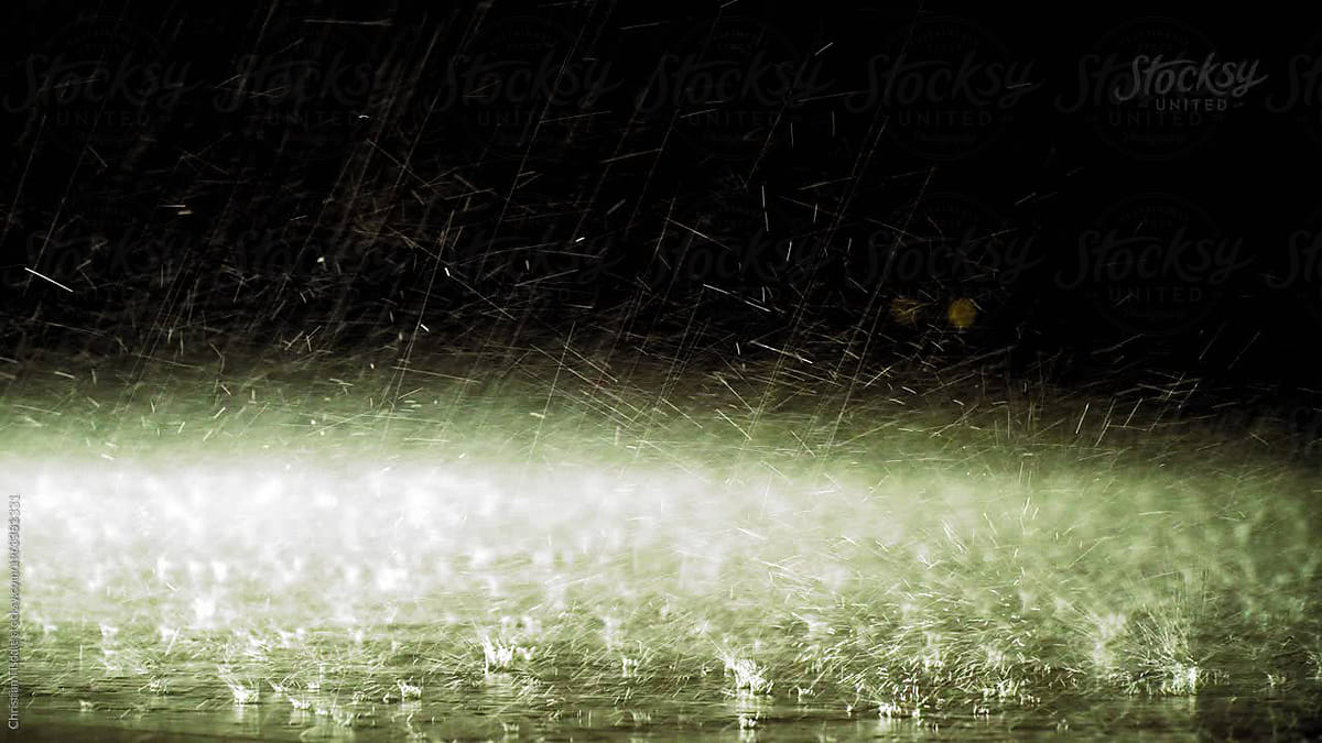 "Rain Pouring Under City Lights" by Stocksy Contributor "Christian ...