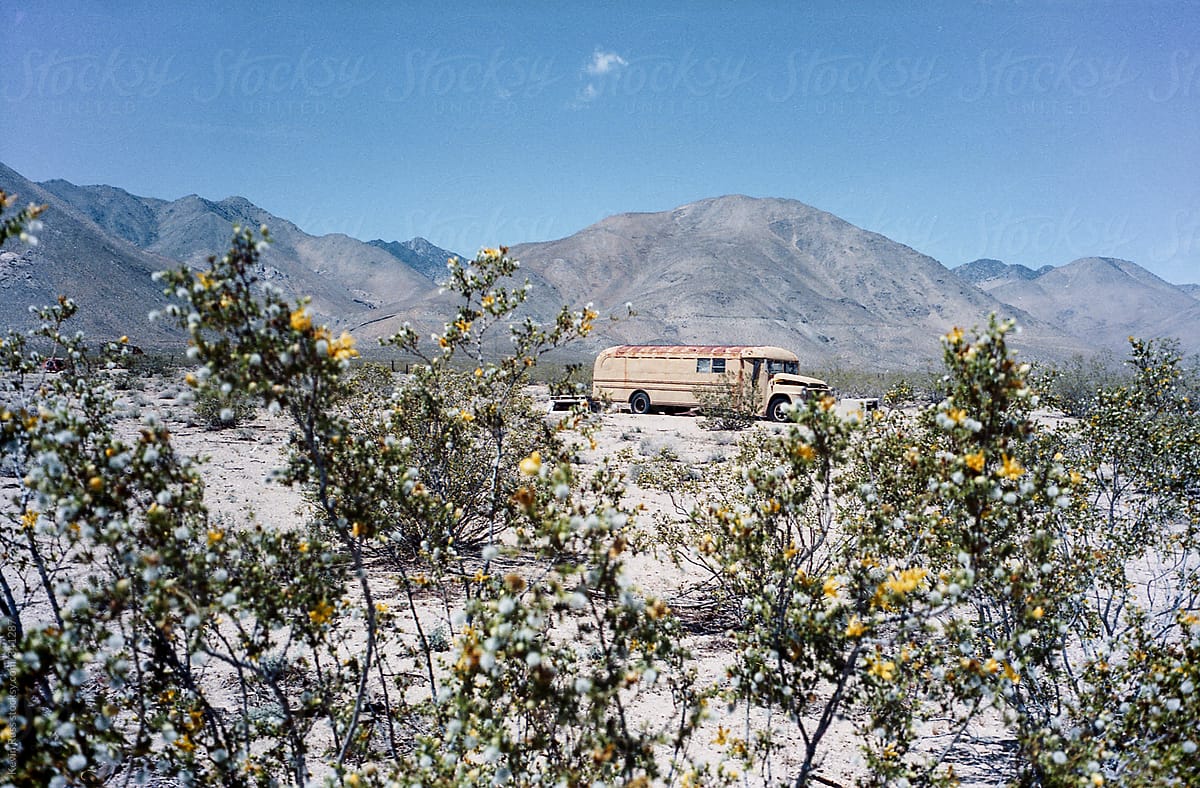 "Abandoned Desert Bus" by Stocksy Contributor "Kevin Russ" - Stocksy