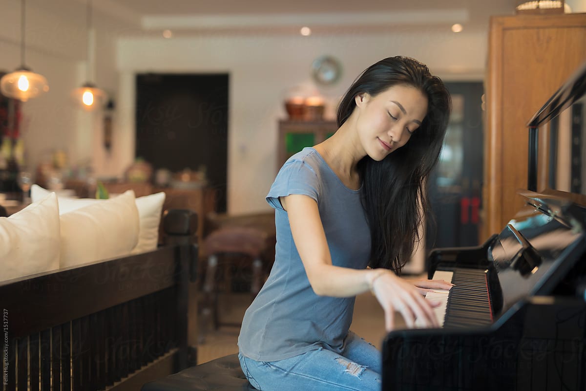 "Young Asian Woman At Home On Her Piano" by Stocksy Contributor "Eyes ...