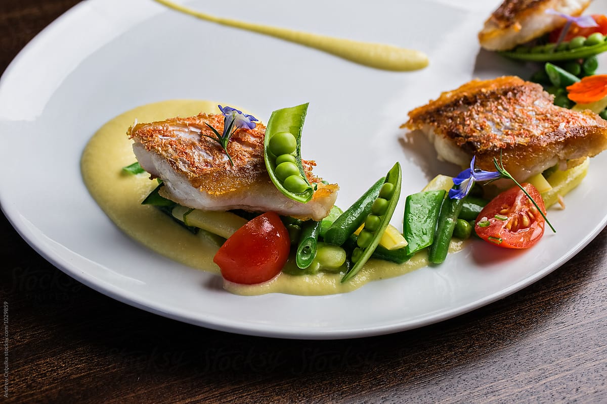 "Fish With Peas And Tomatoes" by Stocksy Contributor "Andrew Cebulka ...