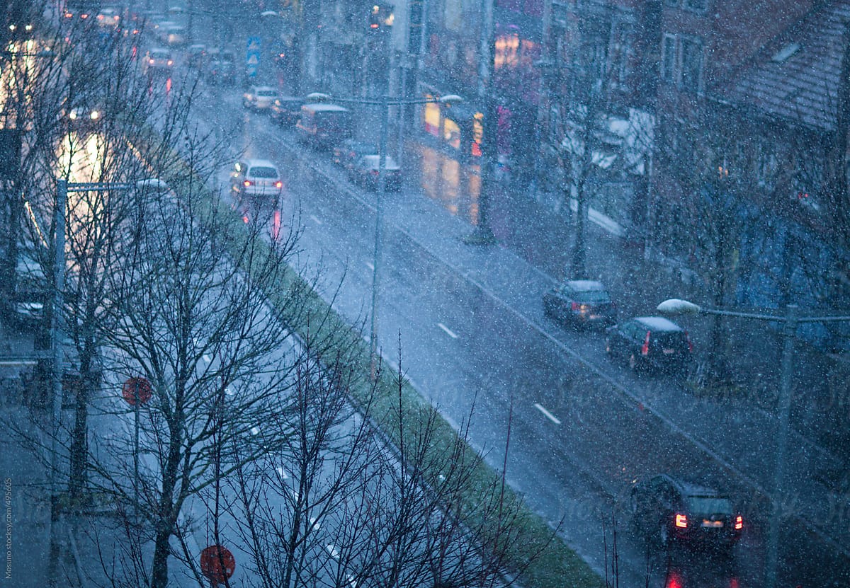 "Street Traffic On A Snowy Day" by Stocksy Contributor "Mosuno" - Stocksy