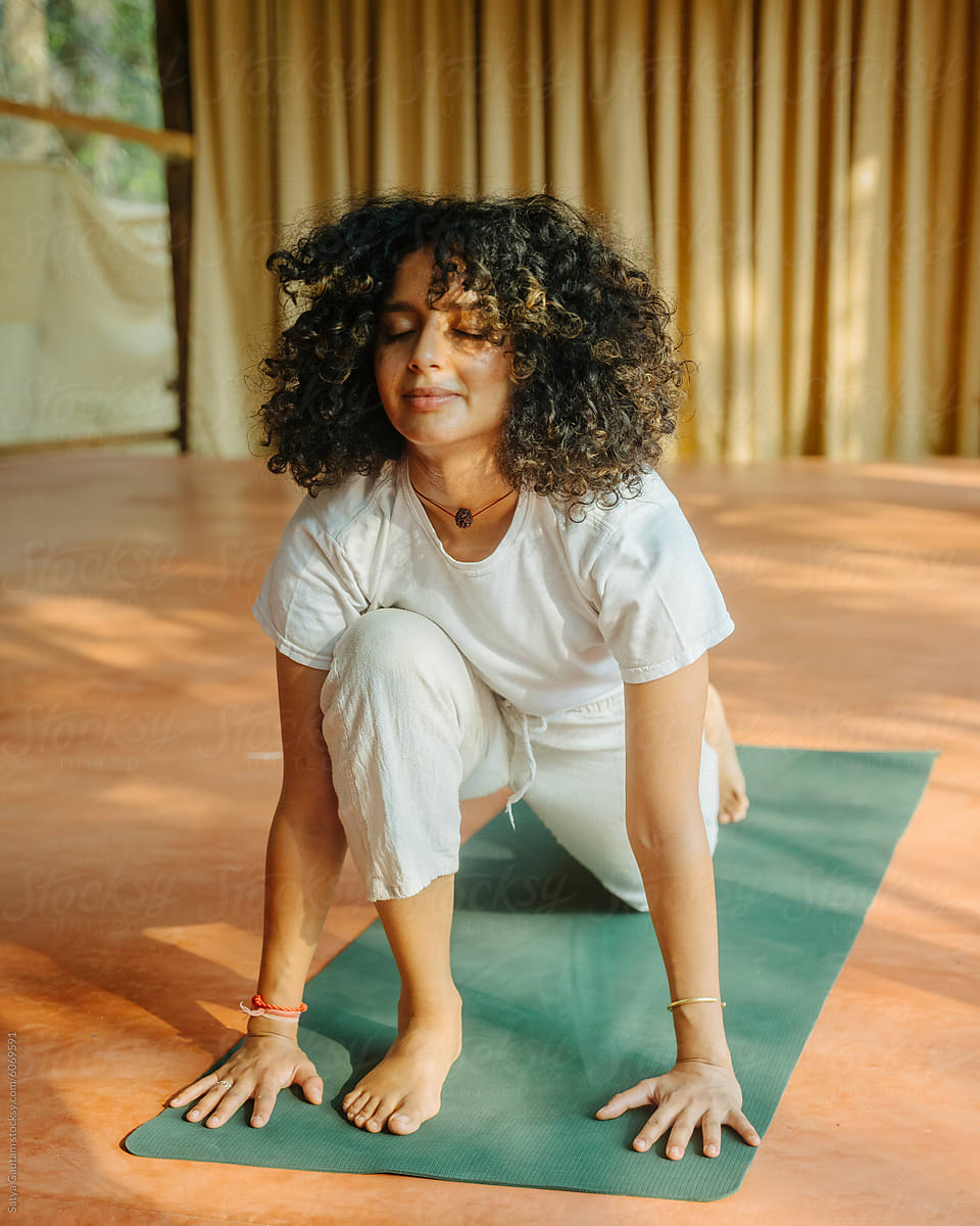 "Girl In Equestrian Pose During Morning Yoga In Tropical Setting" by ...