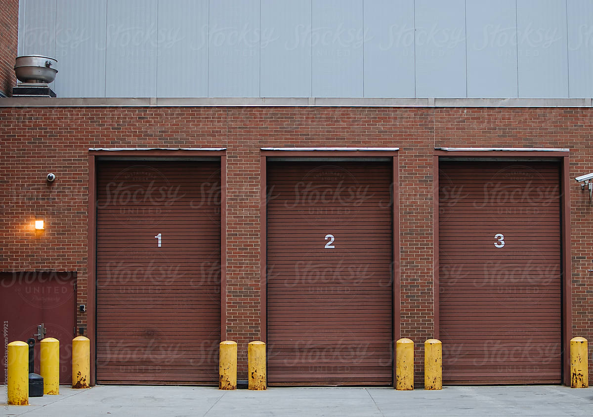 "Three Numbered Garage Doors" by Stocksy Contributor "Margaret Vincent ...
