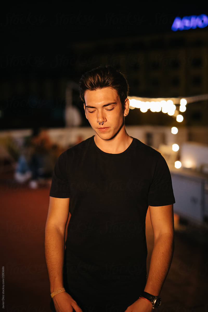 "Handsome Guy On A Night Terrace Party" by Stocksy Contributor "Javier ...