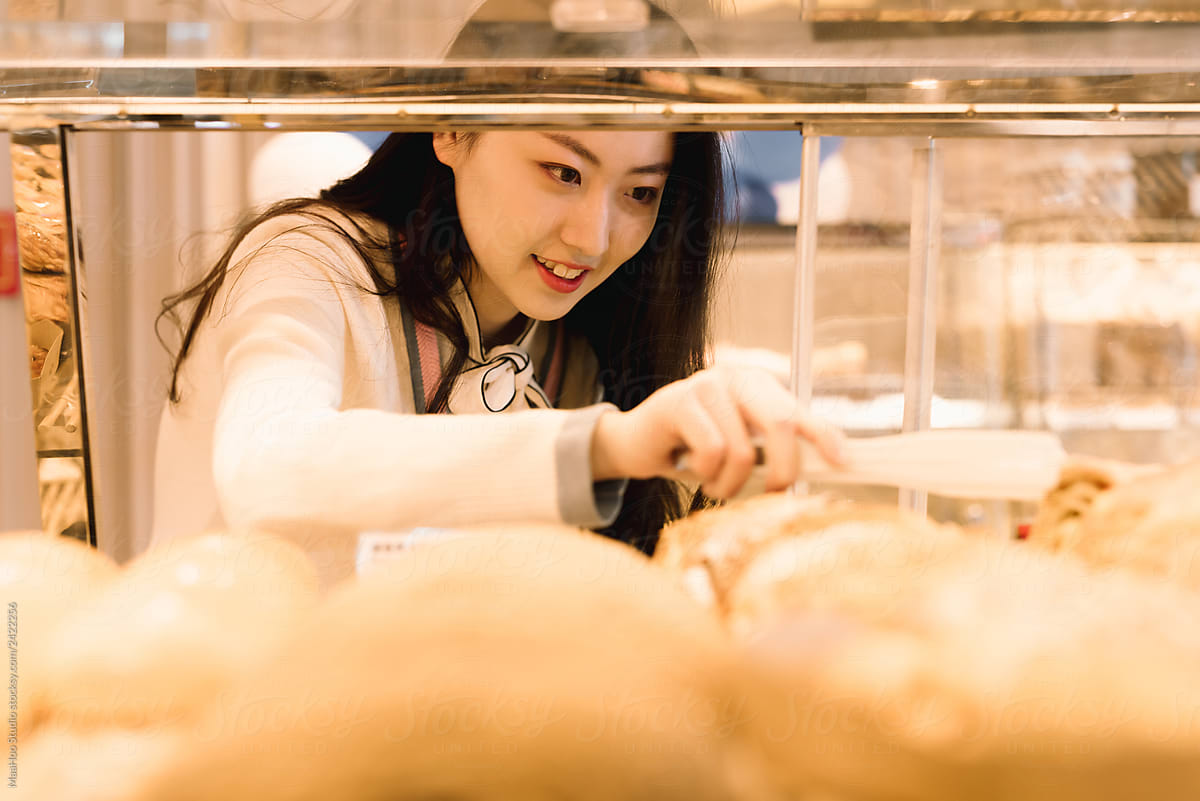 "Young People In Bakery" by Stocksy Contributor "MaaHoo" - Stocksy