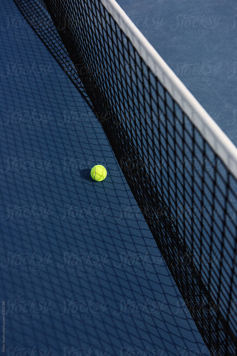 "Tennis Ball At Net" by Stocksy Contributor "Milles Team" - Stocksy