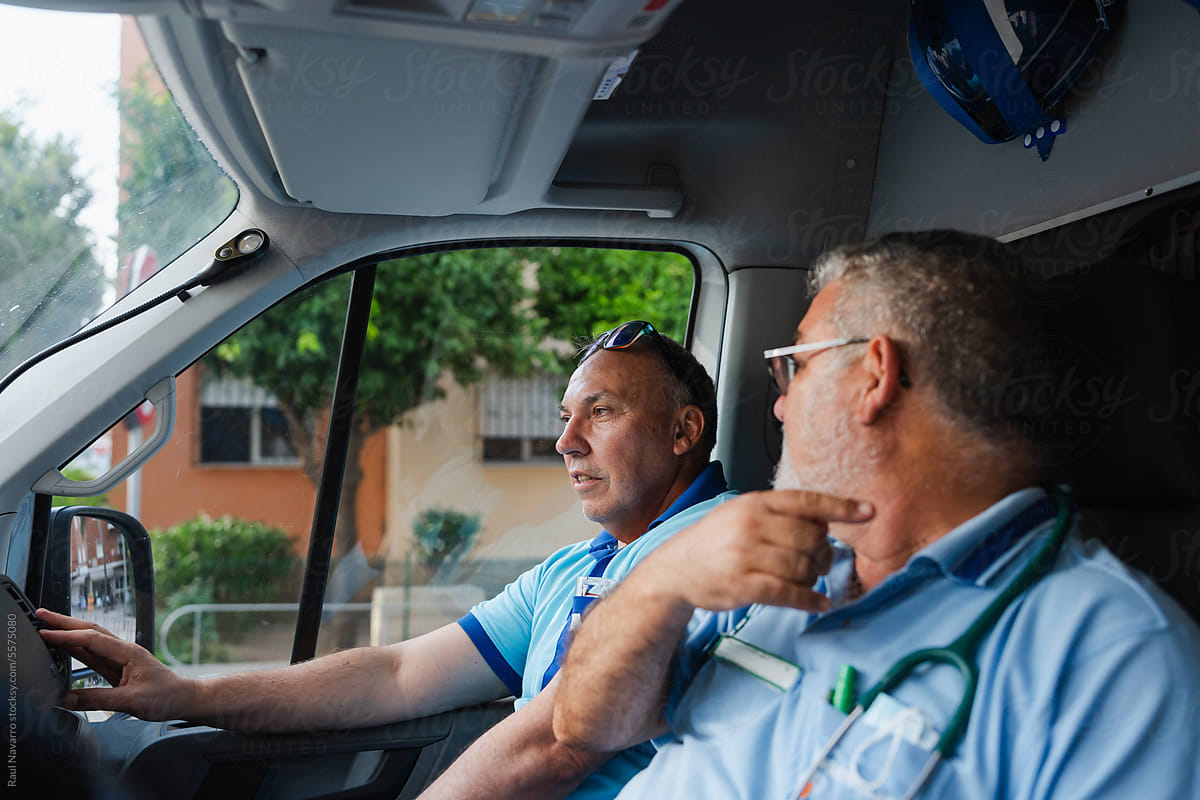 "Two Paramedics Working On An Ambulance" by Stocksy Contributor "Raul ...