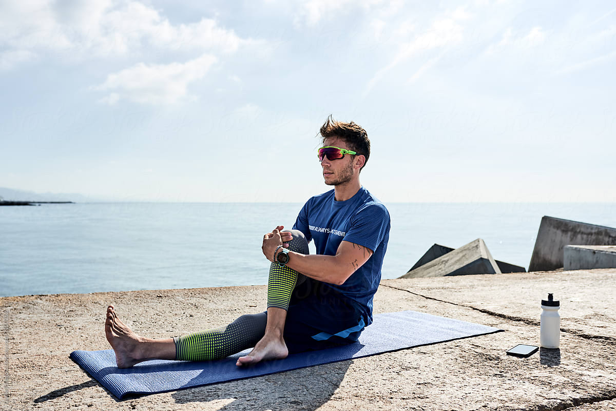 "Flexing Adult Sportsman On Waterfront" by Stocksy Contributor "Guille ...