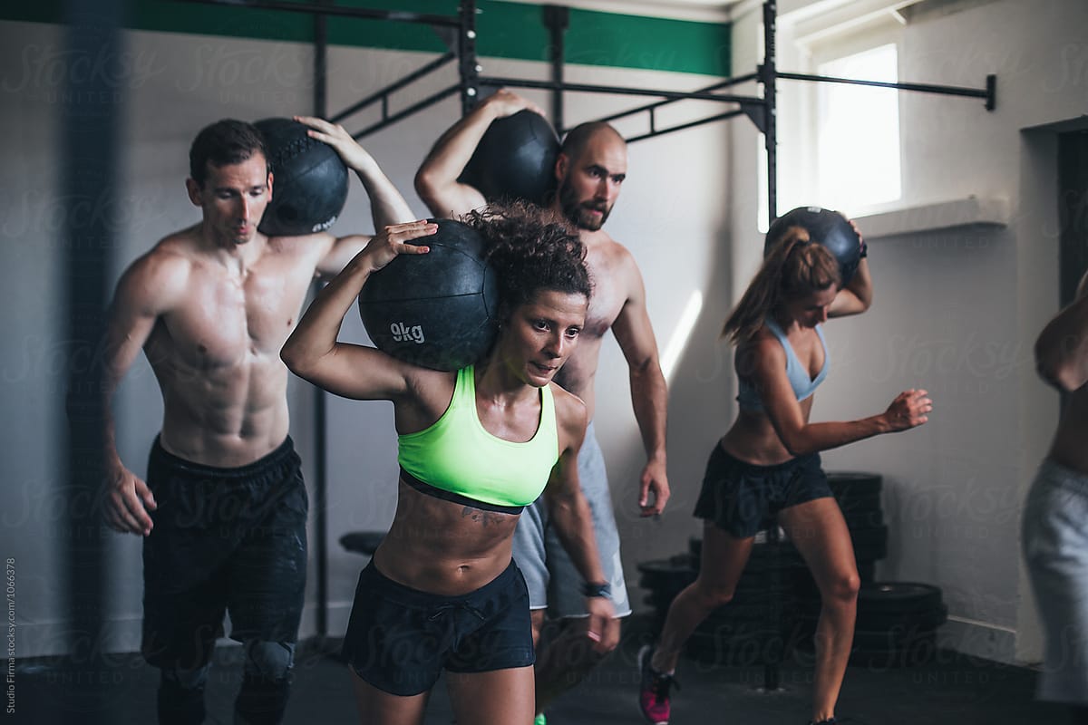 "Group Workout In The Gym" by Stocksy Contributor "Studio Firma" - Stocksy