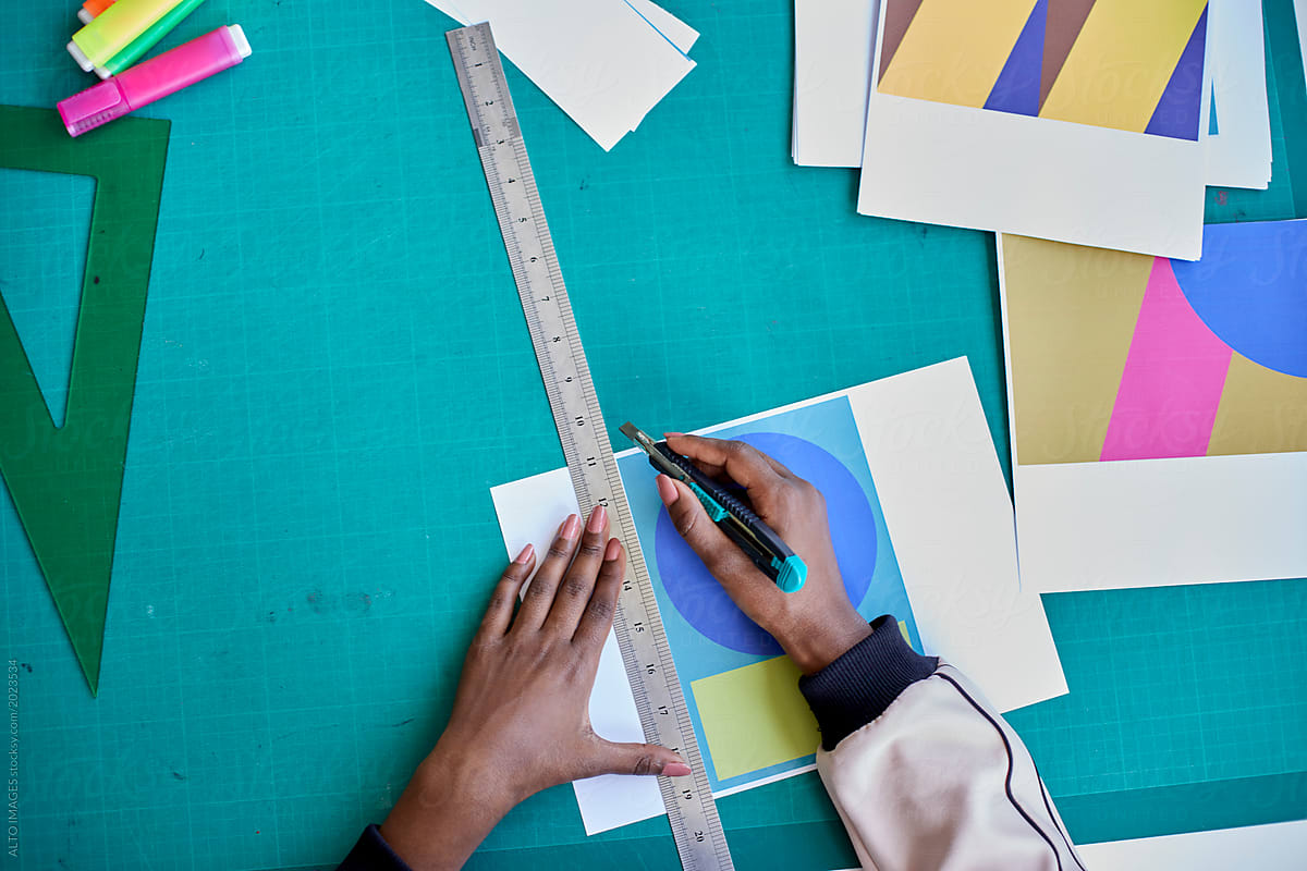 "Cropped Image Of Executive Cutting Paper At Table" by Stocksy ...