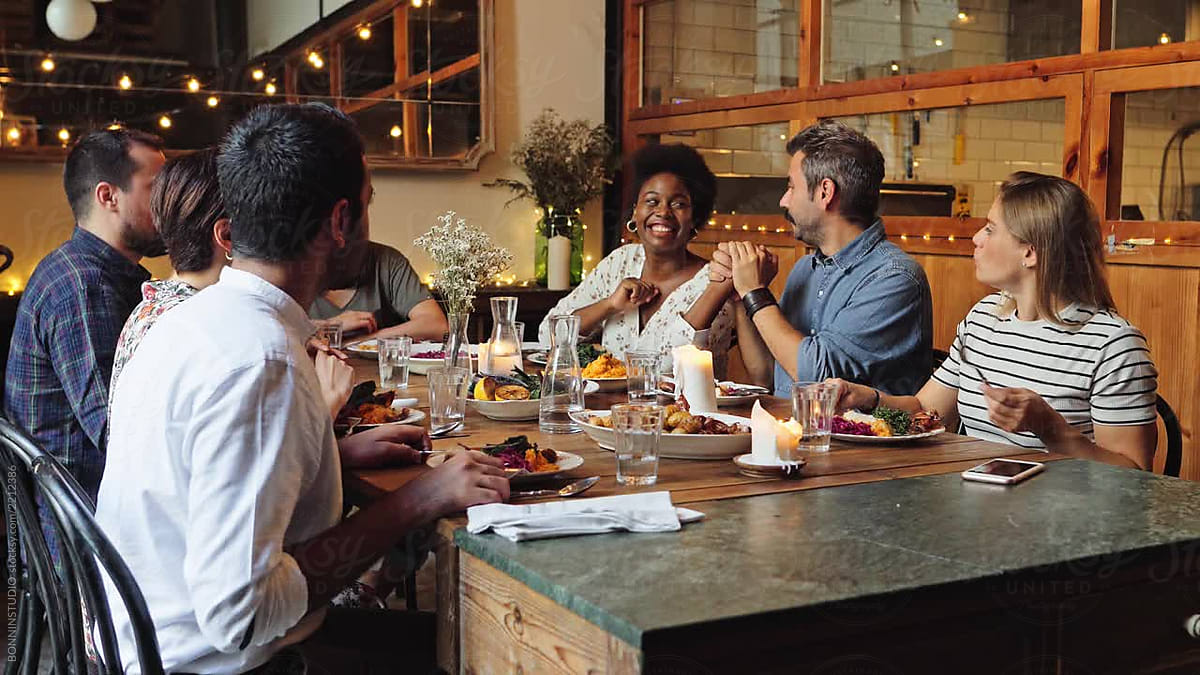 "Dinner With Friends." by Stocksy Contributor "BONNINSTUDIO " - Stocksy