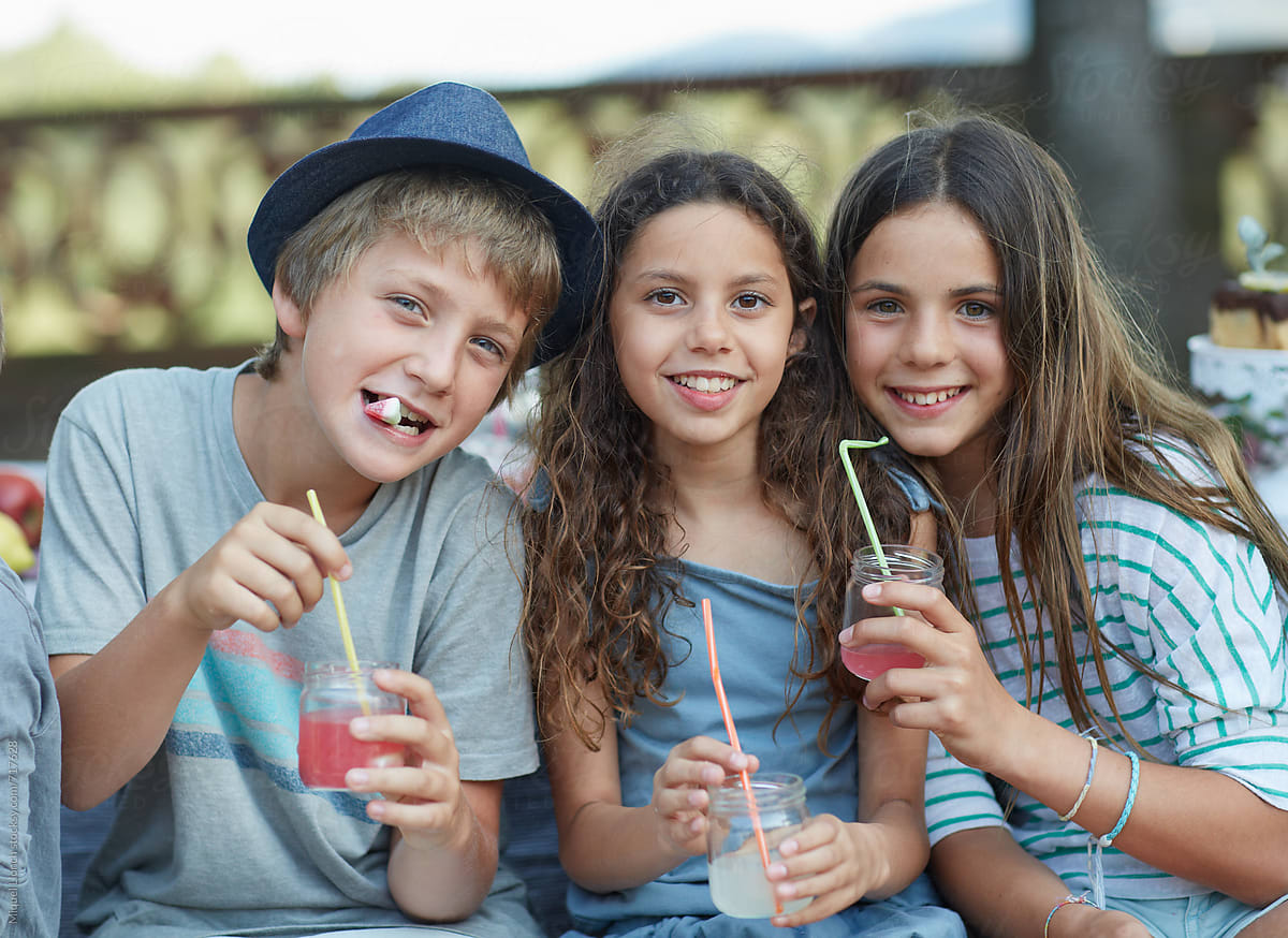 "Portrait Of Three Children In A Party" by Stocksy Contributor "Miquel ...