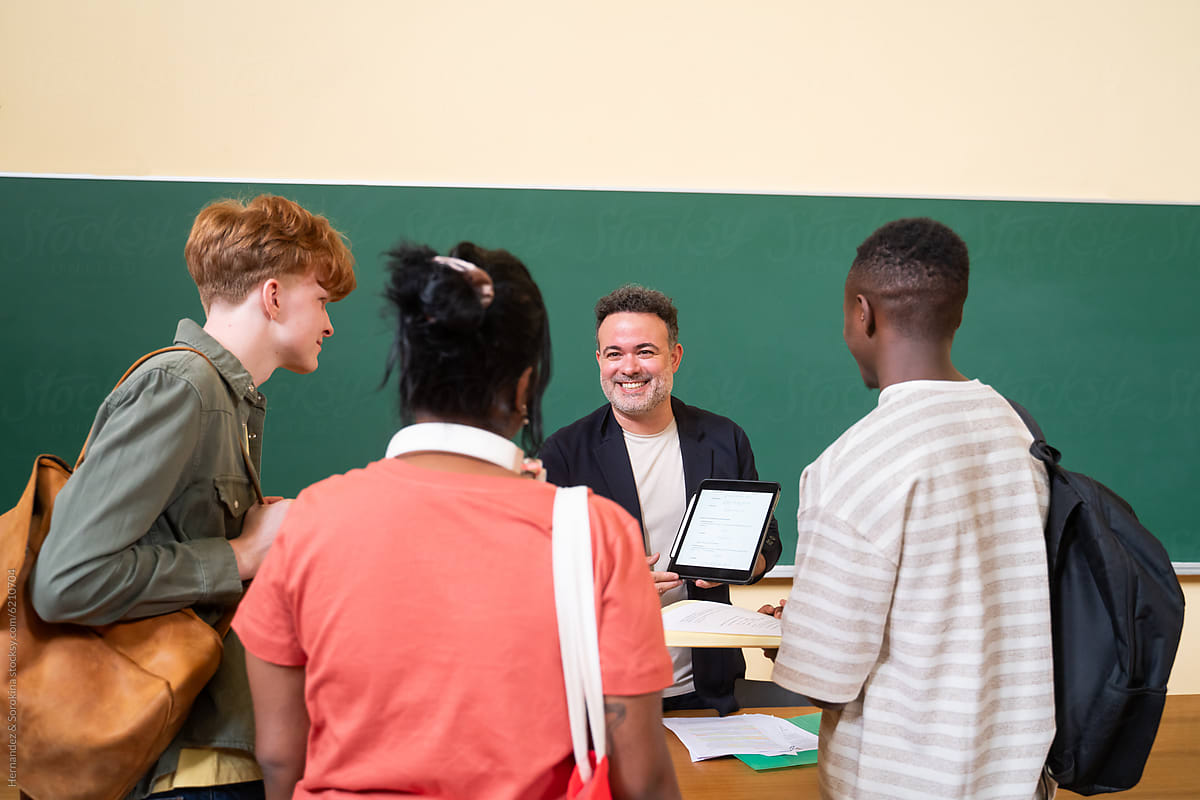 "Smiling Professor Talking To His Students" by Stocksy Contributor ...