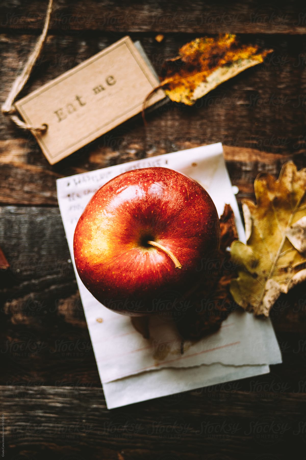 "Apple On Wooden Table" by Stocksy Contributor "Giada Canu" - Stocksy
