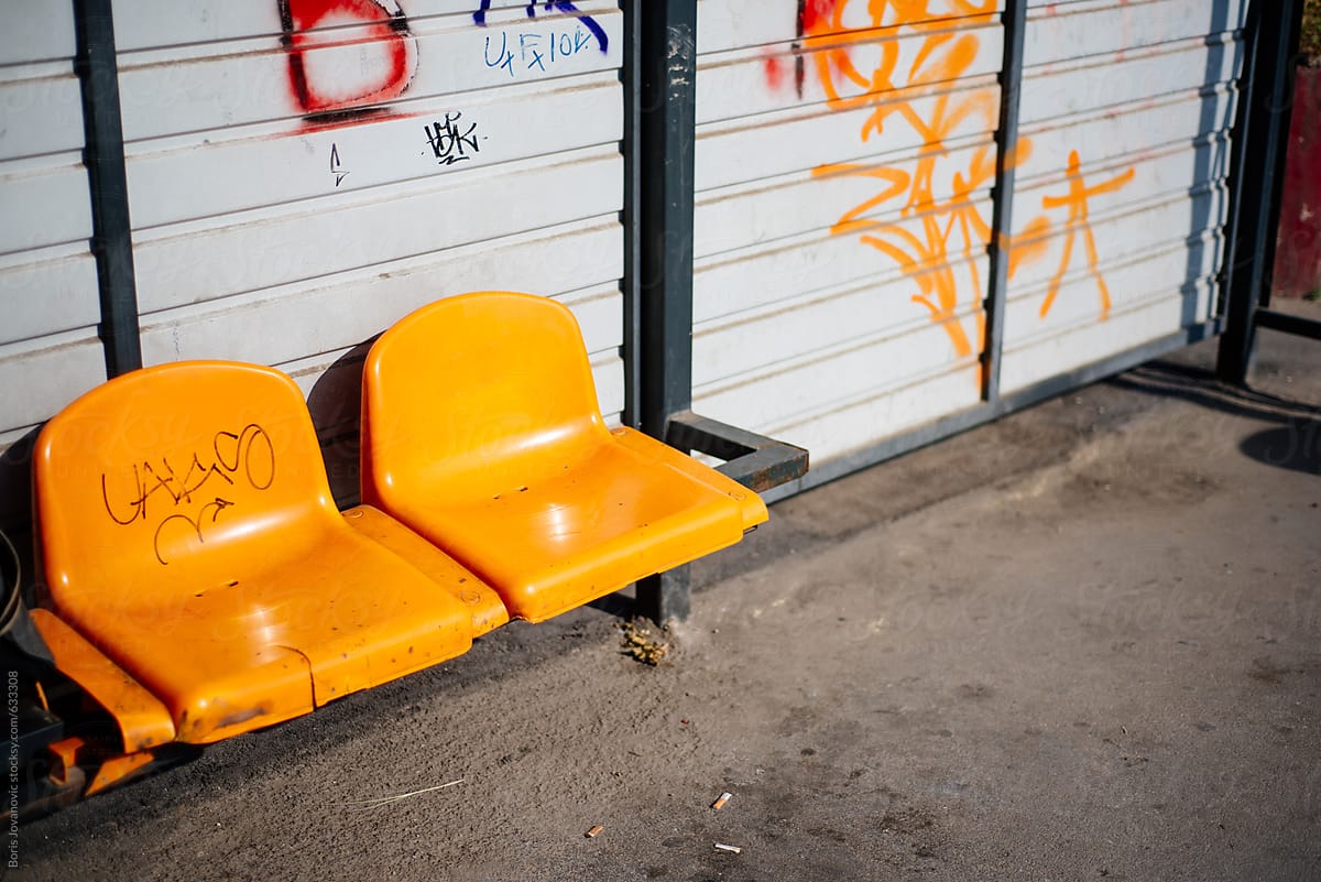 "Bus Stop Seats" by Stocksy Contributor "Boris Jovanovic" - Stocksy
