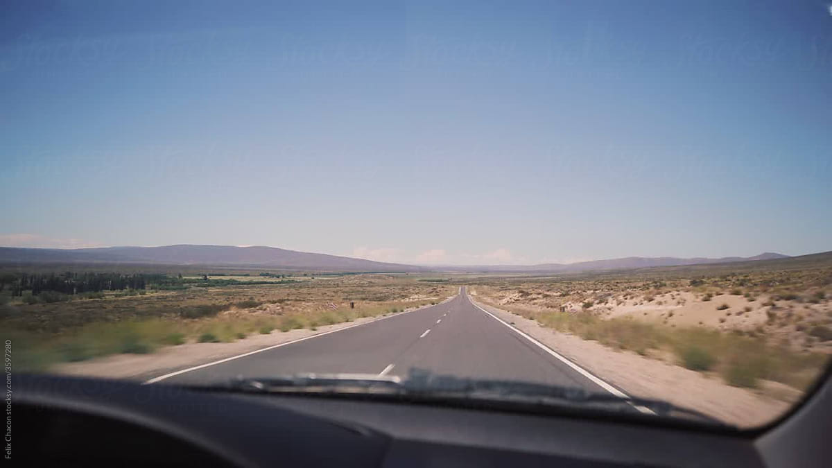 "Car View Of A Road" by Stocksy Contributor "Felix Chacon" - Stocksy