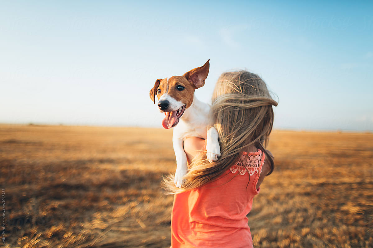 "Child Carrying Dog" by Stocksy Contributor "Pardina Studio x Katya D ...