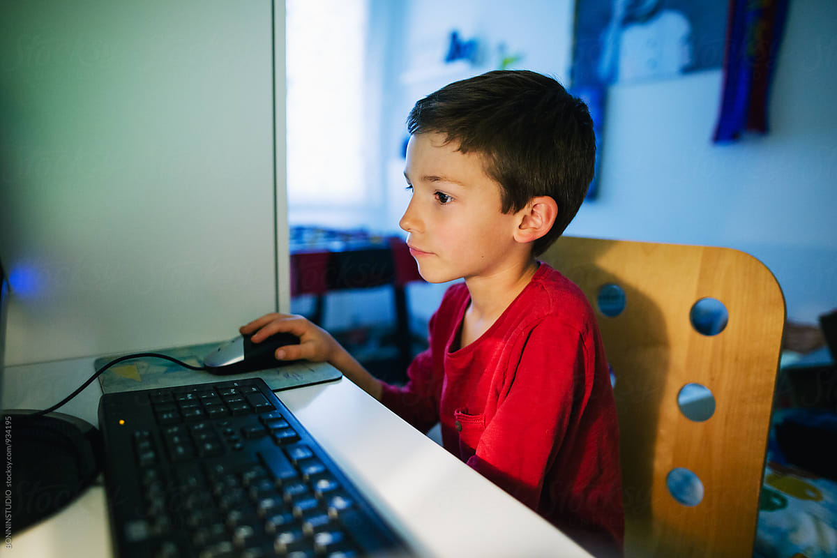 "Side View Of A Little Boy Studying On Computer At Home." by Stocksy ...