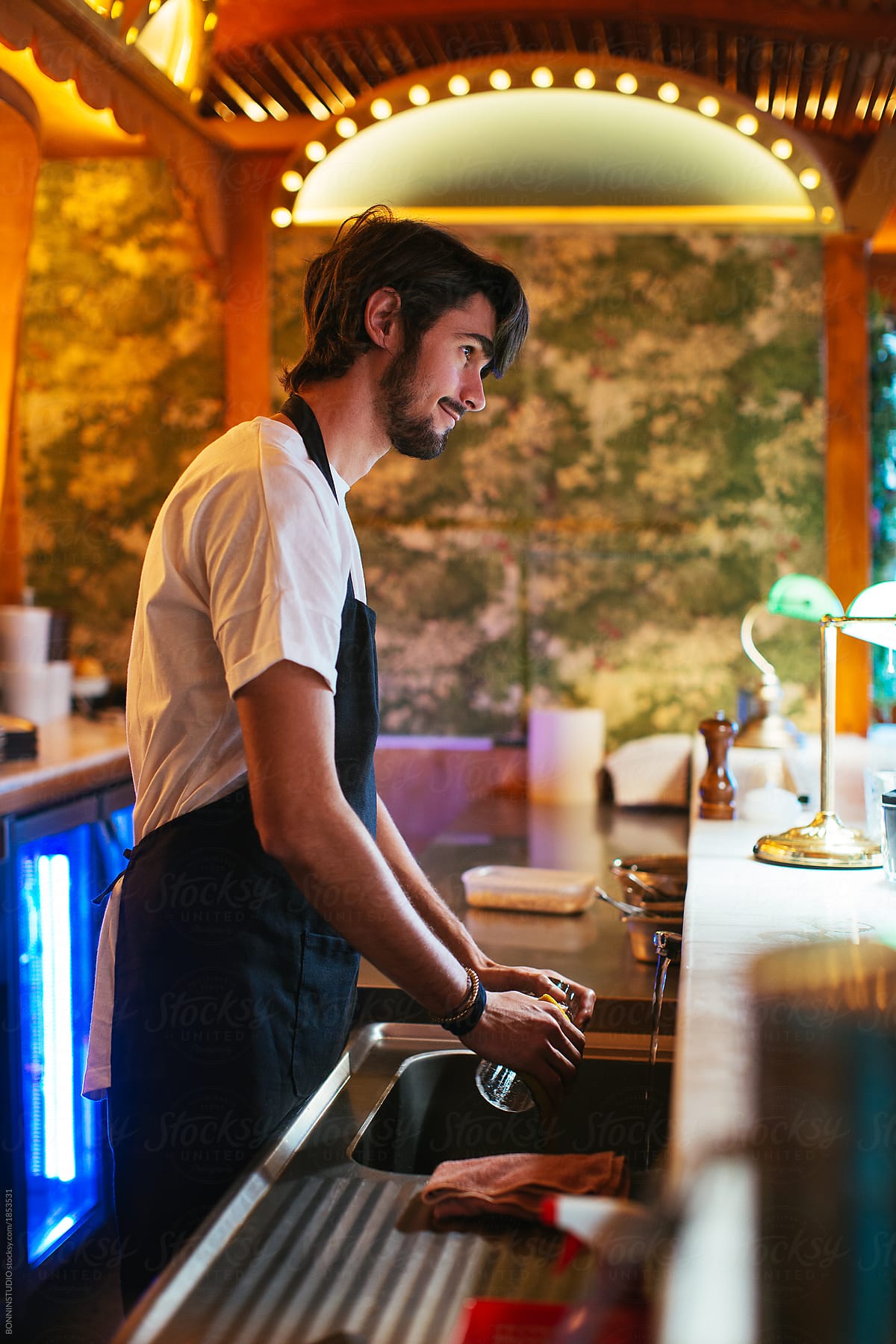 "Side View Of A Waiter Working In A Restaurant." by Stocksy Contributor ...