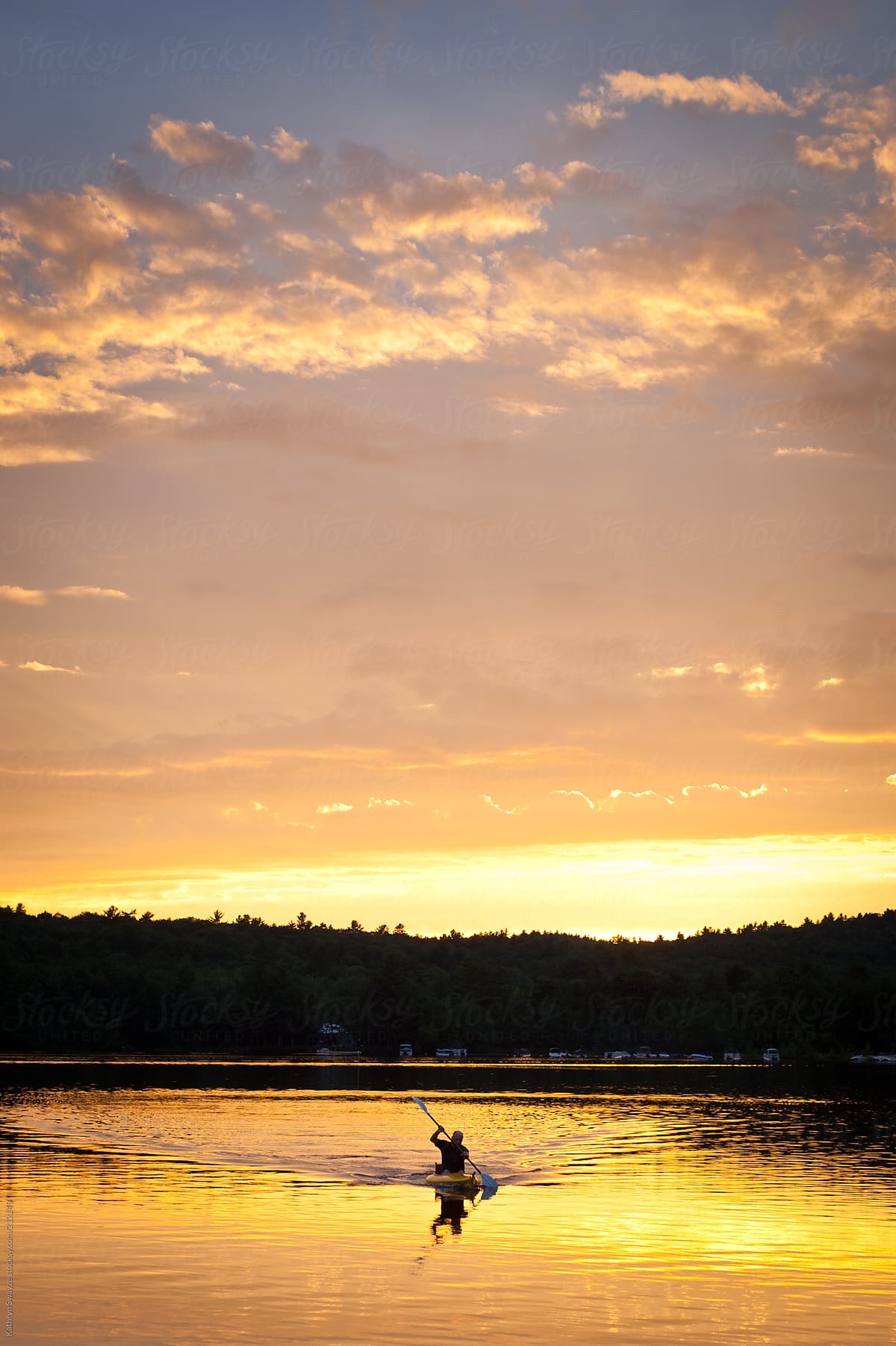 "Man Paddling A Kayak In A Lake At Sunset" by Stocksy Contributor ...