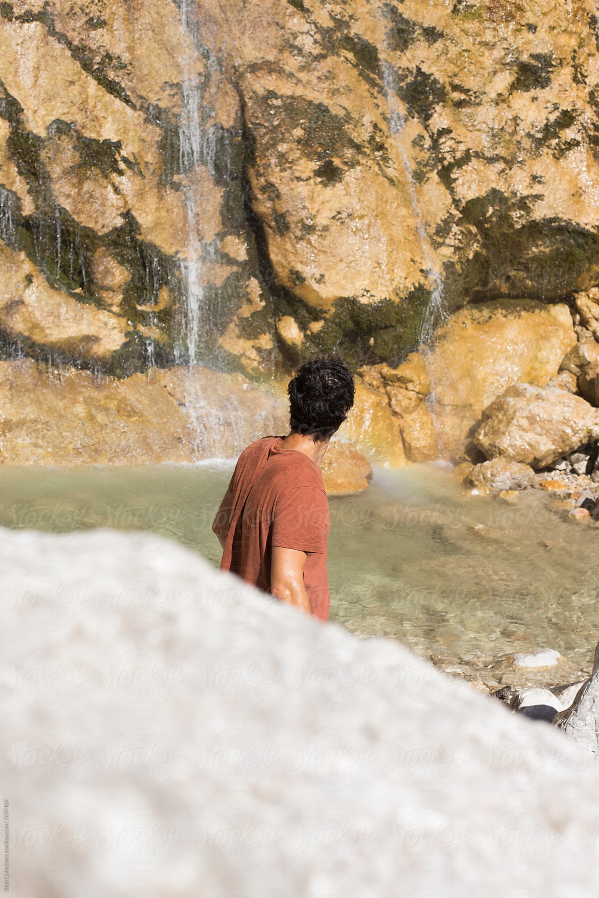 "Man Watching Waterfall" by Stocksy Contributor "Jordi Rulló" - Stocksy