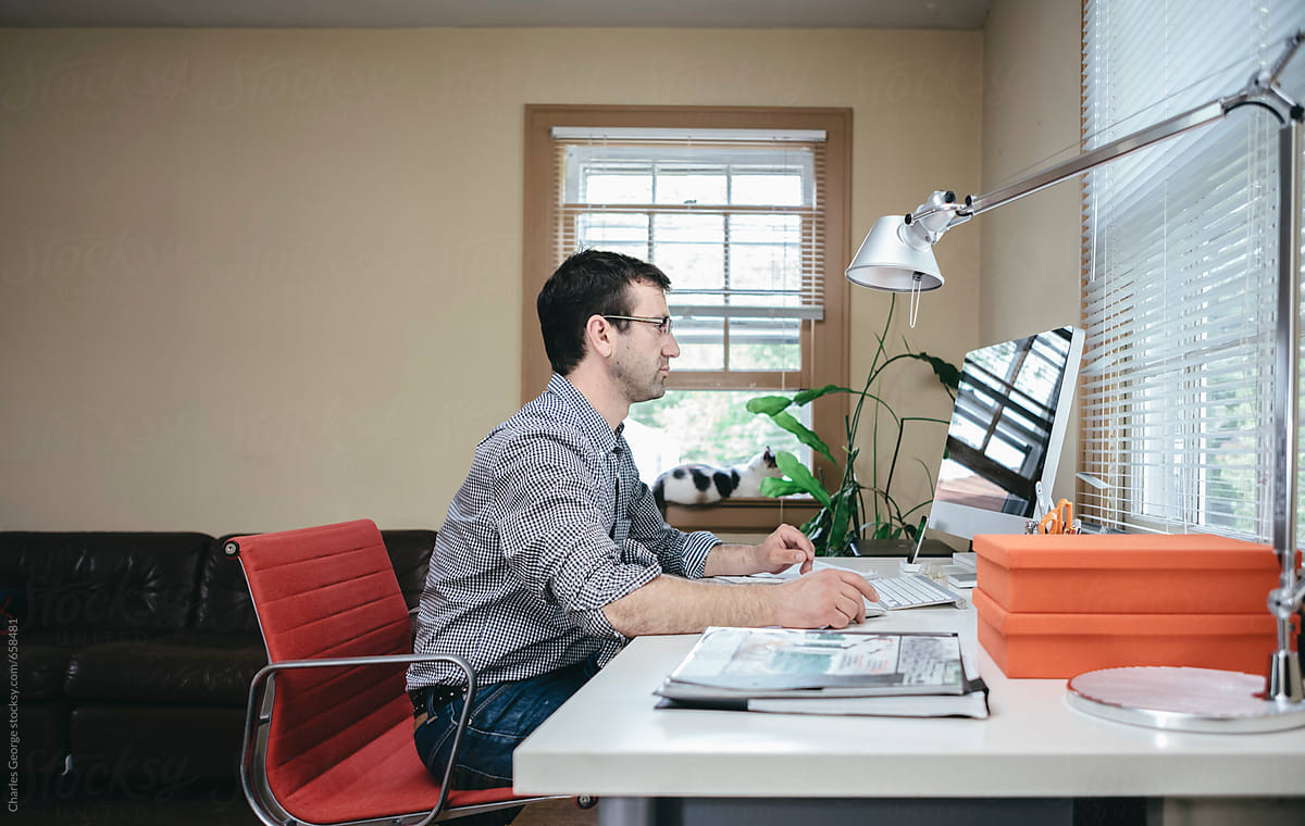"Man Working At Home Office Desk Using Computer" by Stocksy Contributor ...