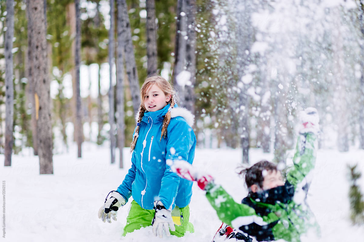 "Girl And Boy Playing In Deep Snow In Winter" by Stocksy Contributor ...