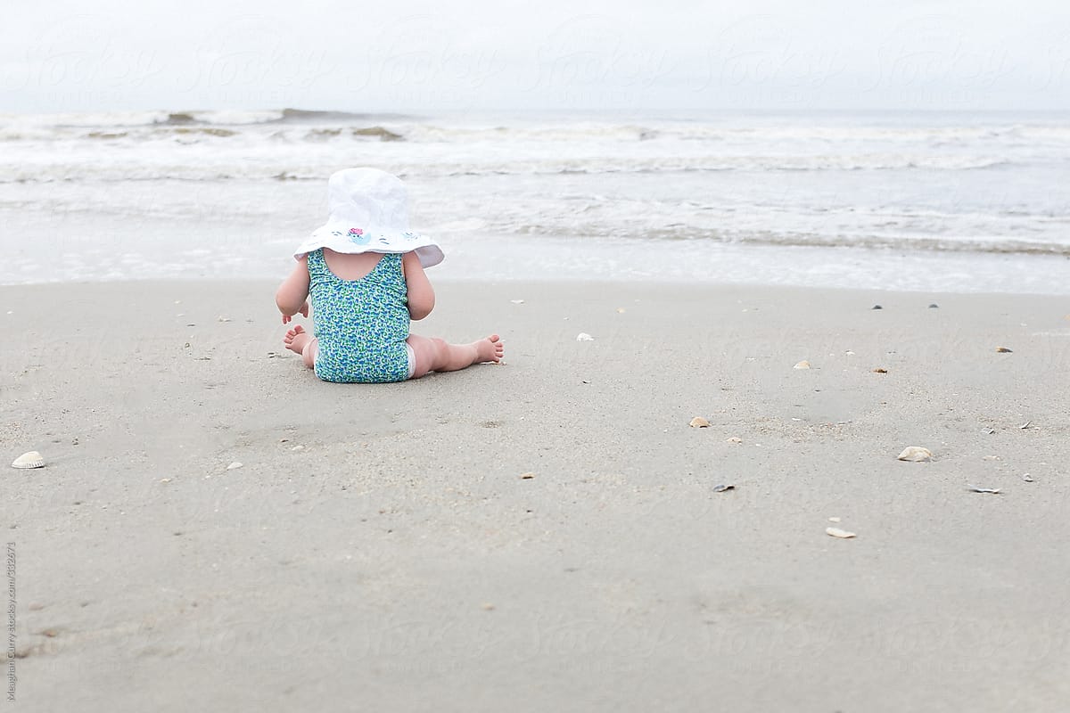 "Baby Playing At The Ocean" by Stocksy Contributor "Meaghan Curry ...