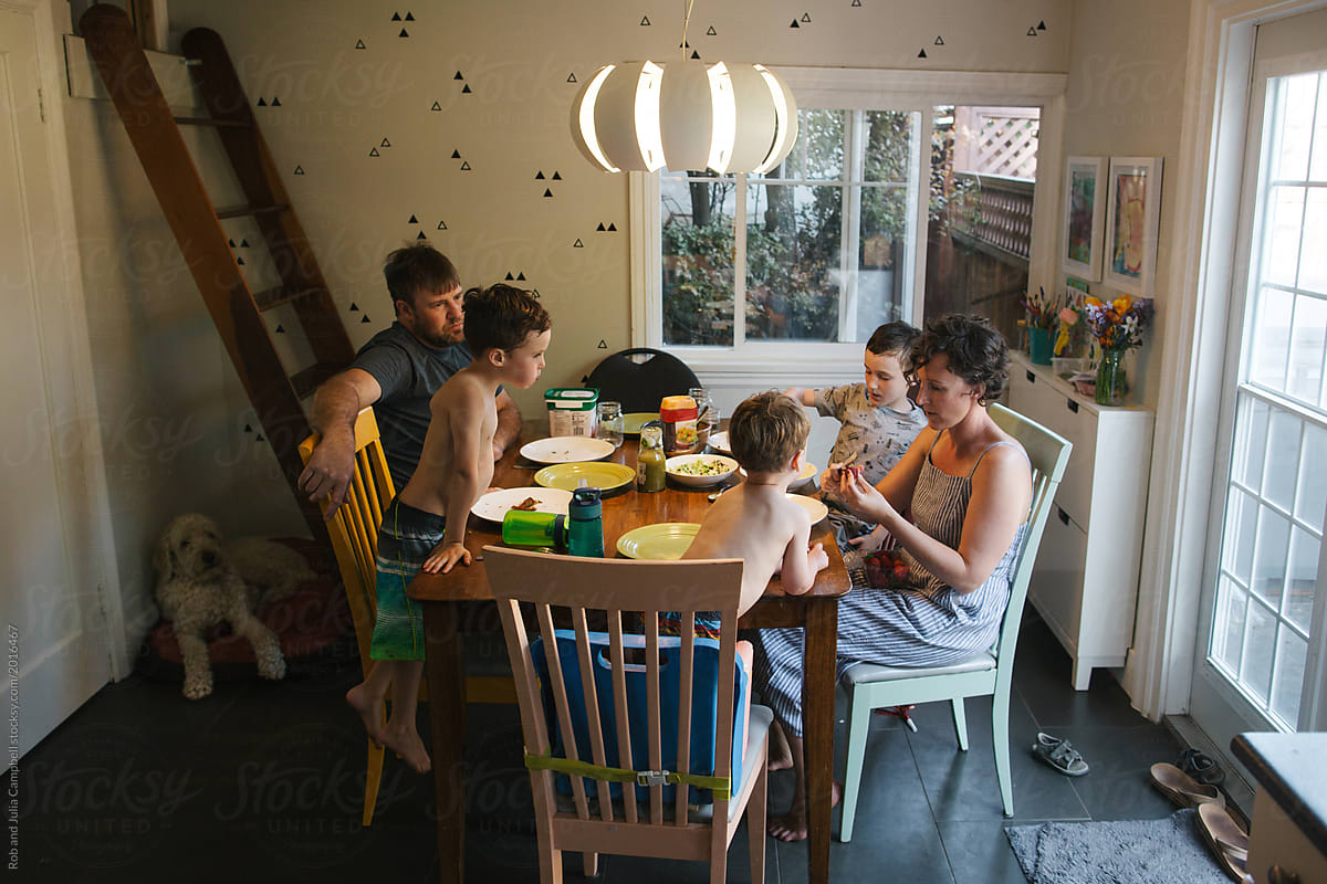 "Family Of Five Eating Dinner Together At Home" by Stocksy Contributor ...