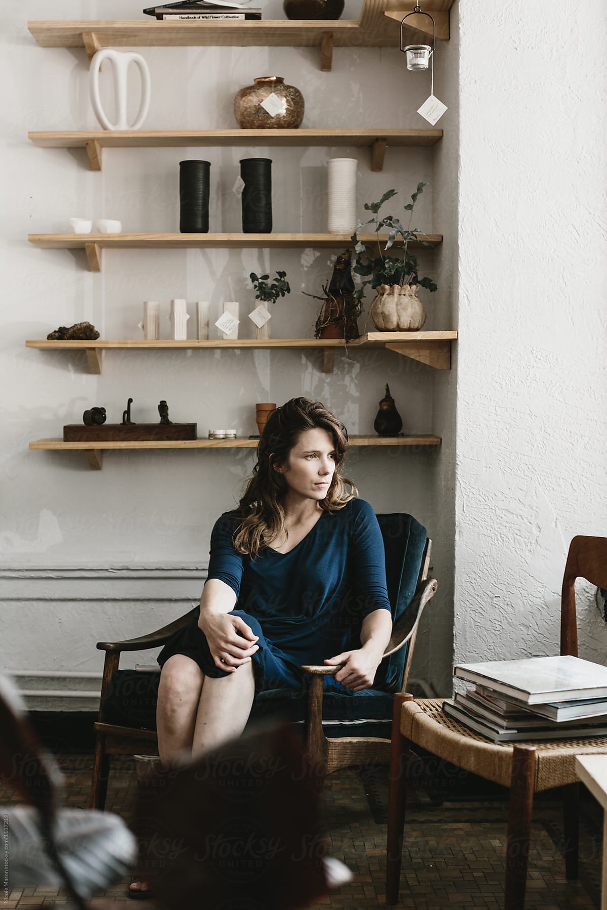 "Portrait Of Woman Sitting In Studio Shop" by Stocksy Contributor ...