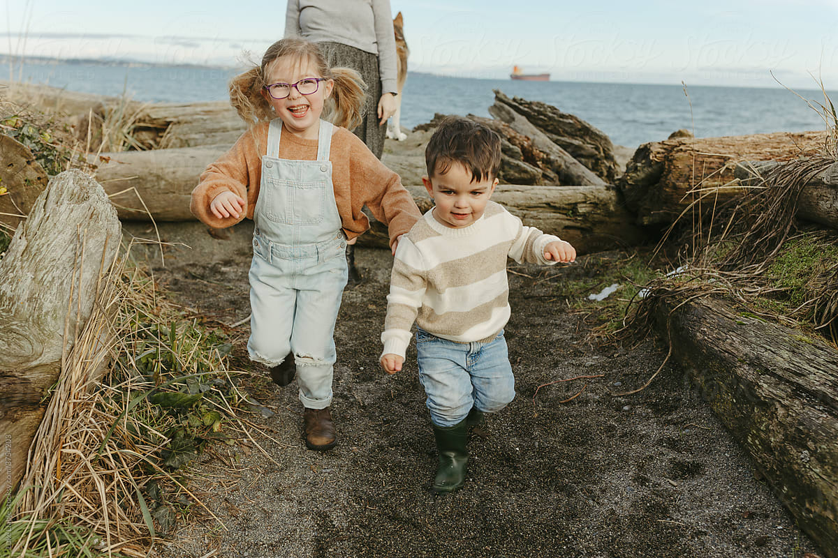 "Kids Holding Hands Running Playing" by Stocksy Contributor "Luke ...