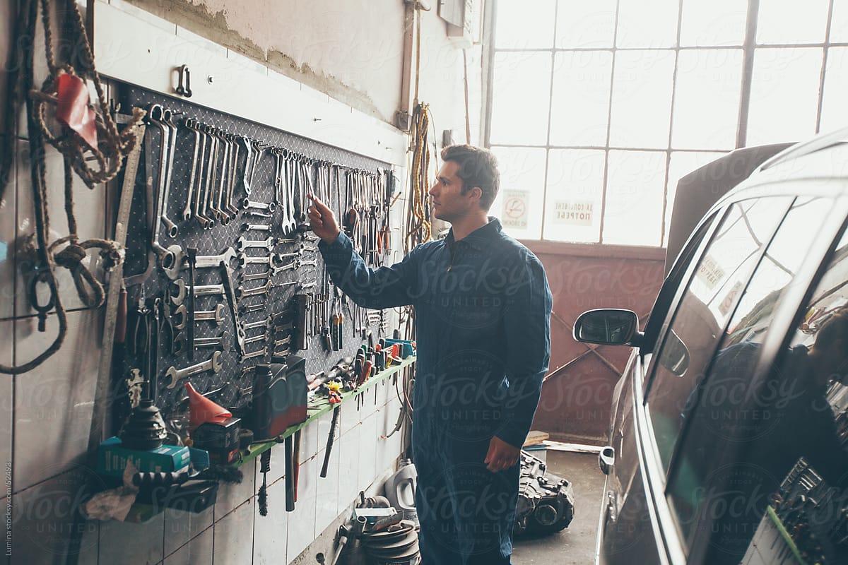 "Mechanic Choosing Tools At His Workshop" by Stocksy Contributor ...