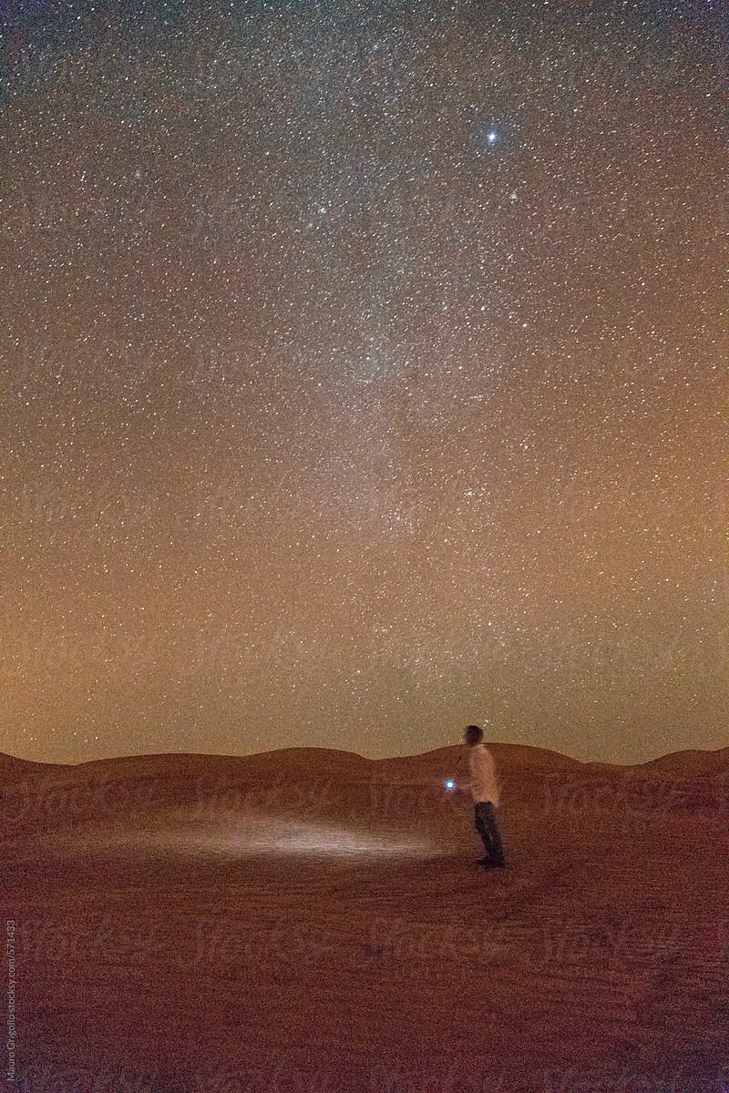 "Man Walking Under The Stars On The Empty Quarter Desert" by Stocksy ...