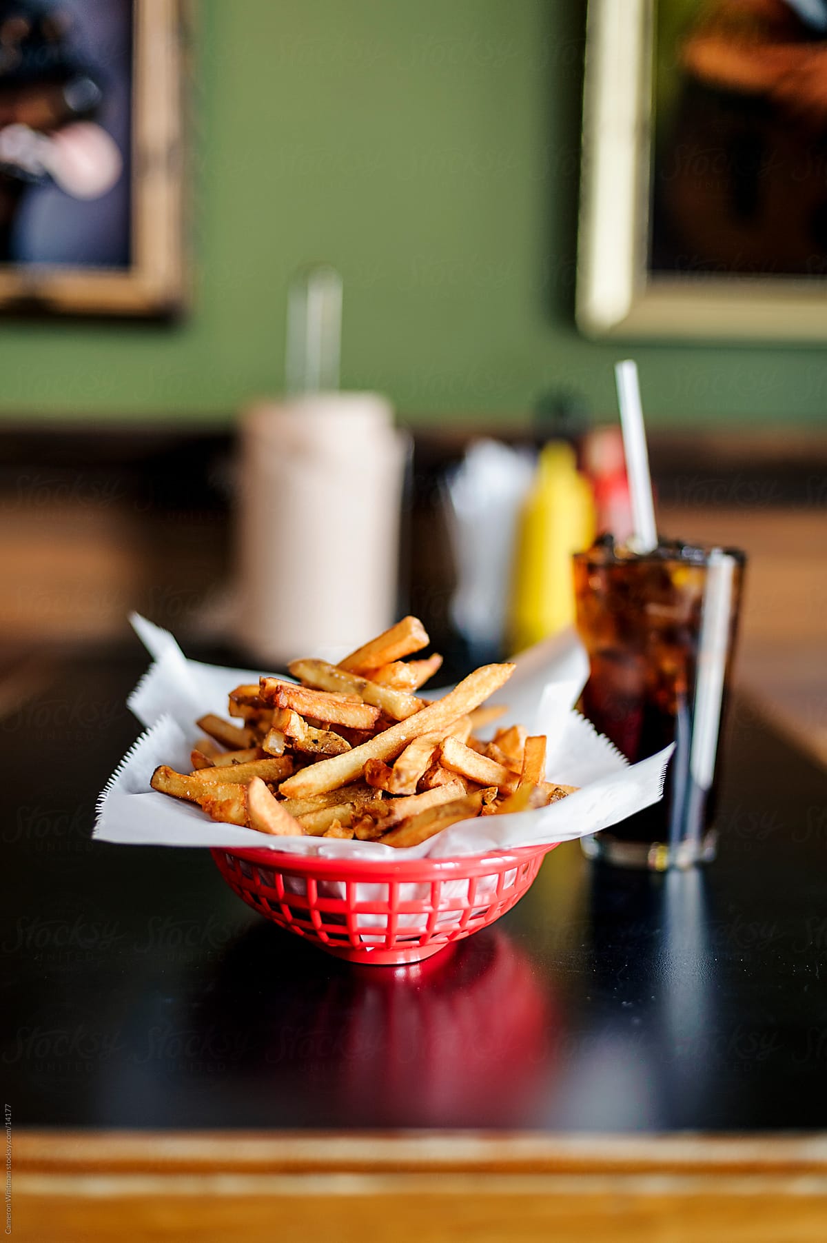 "Bar Food: Fries And Cola" by Stocksy Contributor "CWP, LLC" - Stocksy