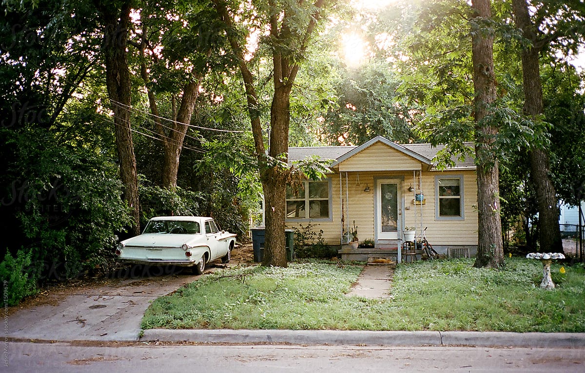 "Classic Vintage Car Parked In Drive Way Of Small Town Home" by Stocksy ...