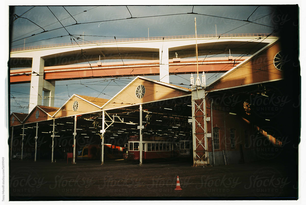 "Retro Tram Terminal In Lisbon With Bridge" by Stocksy Contributor ...